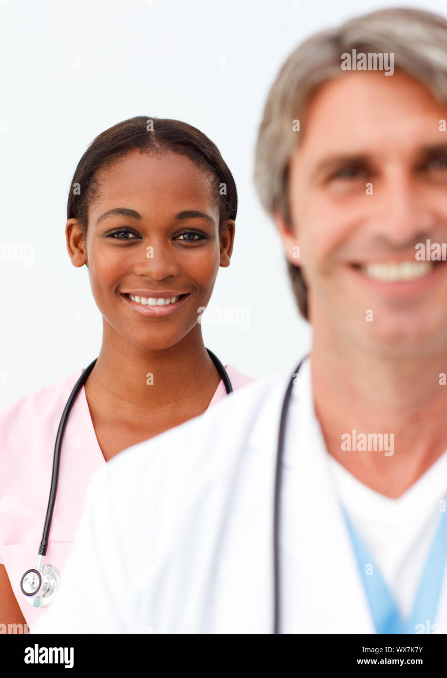 Portrait of two positive doctors against a white background Stock Photo ...