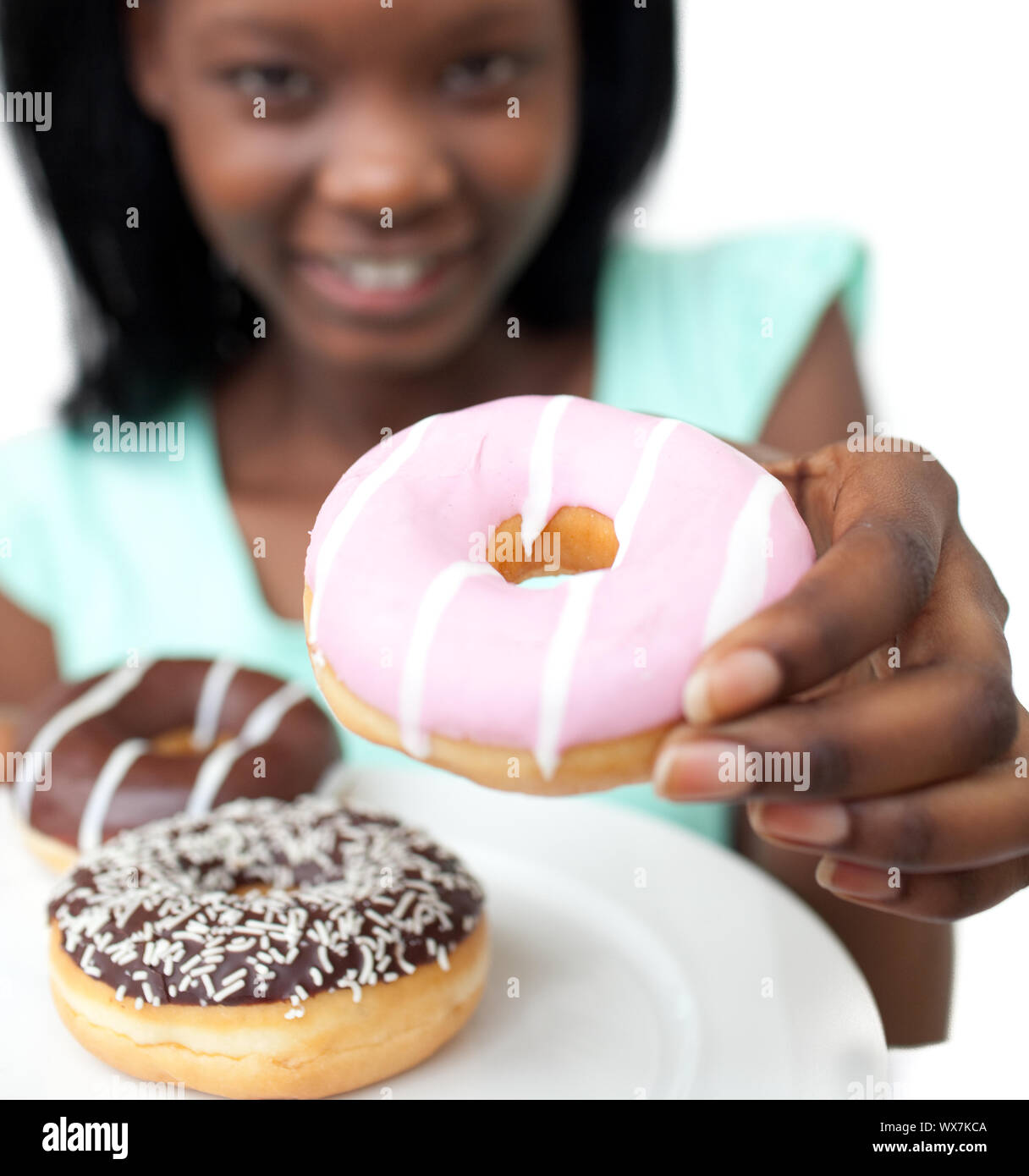 Cheerful woman holding pink donut hi-res stock photography and images ...