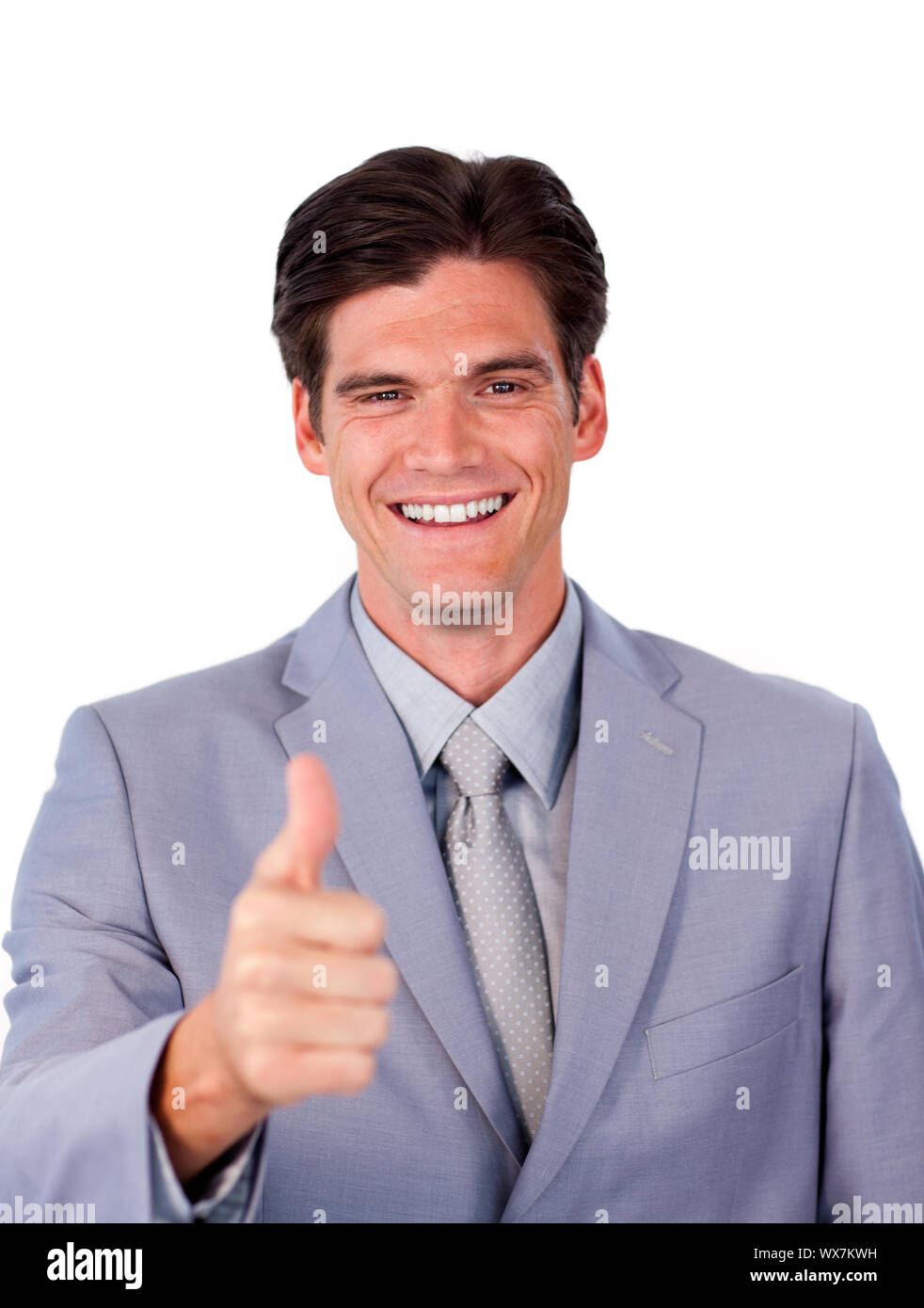 Fortunate businessman with thumb up against a white background Stock ...