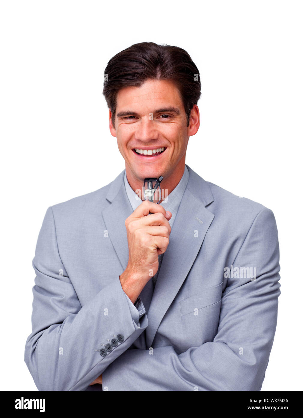 Laughing businessman holding glasses isolated on a white background ...