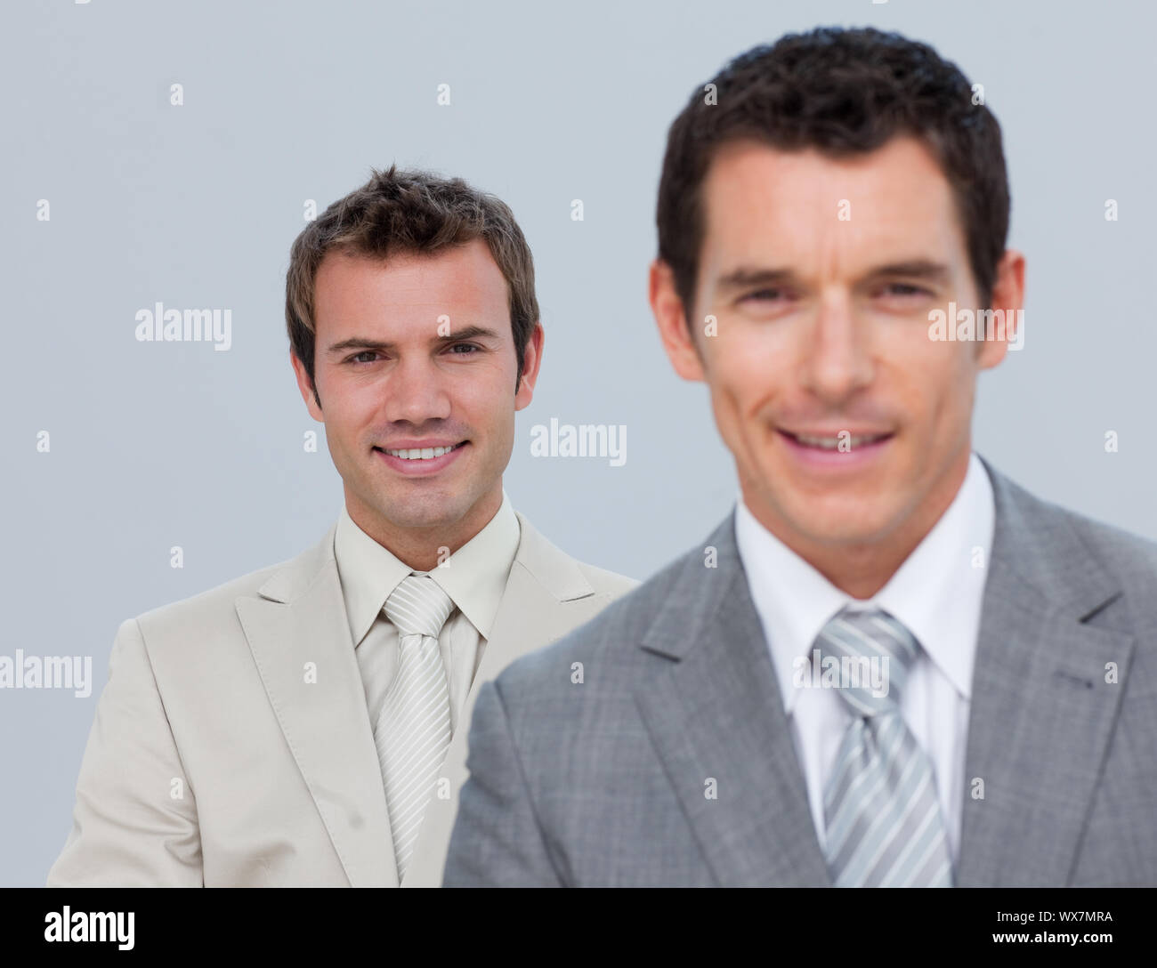 Portrait of smiling businessmen isolated Stock Photo - Alamy