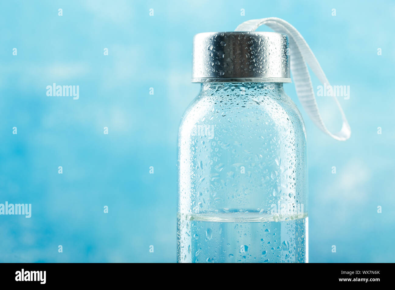 Small glass water bottle Stock Photo - Alamy