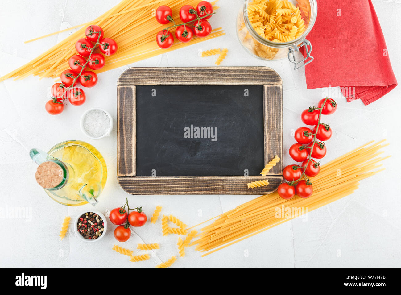 Chalk board with copy space with Ingredients for cooking Italian pasta ...