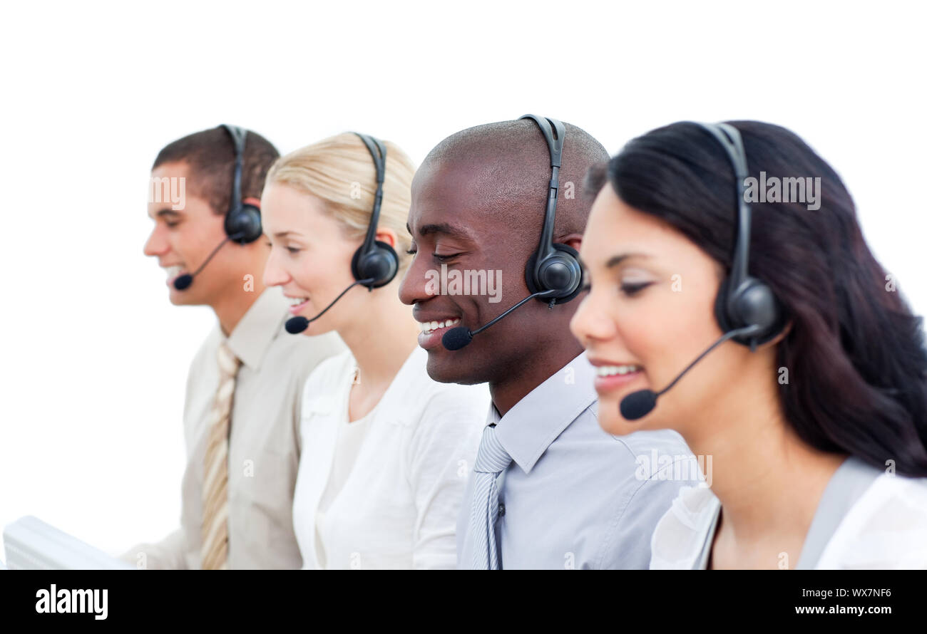 Positive business team working in a call center against a white ...