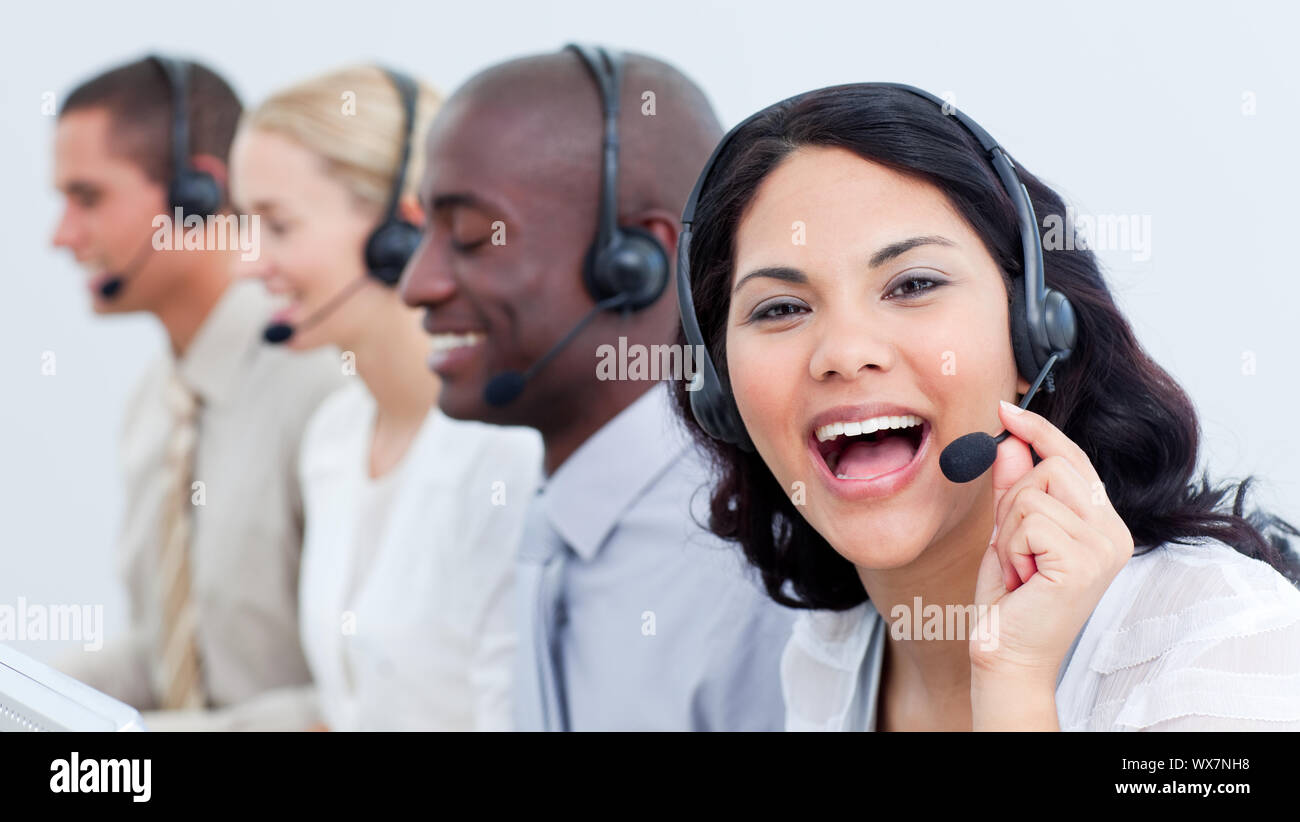 Happy business team talking on headset in a call center Stock Photo - Alamy