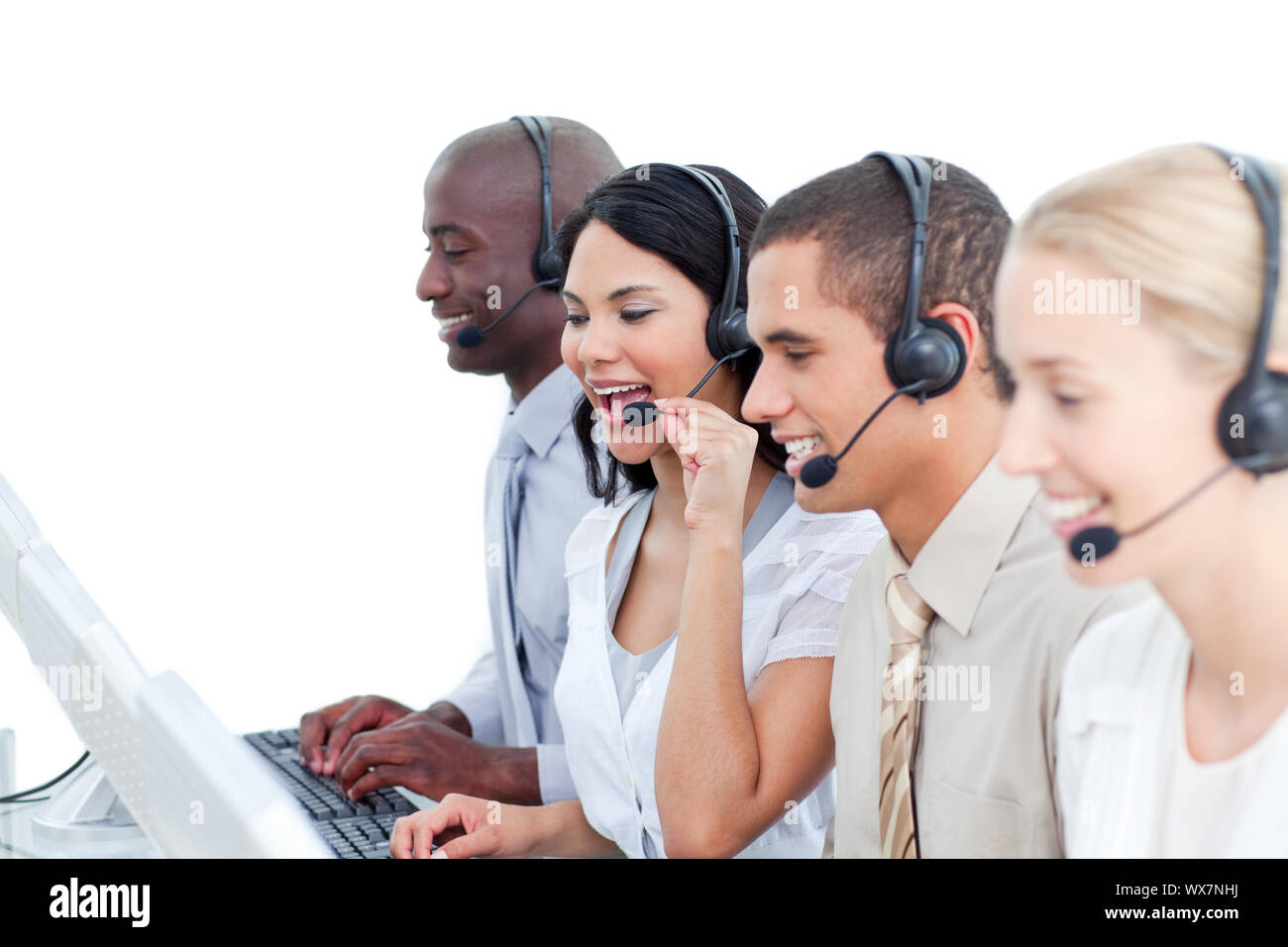 Laughing woman and her team working in a call center against a white ...