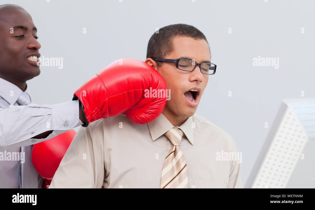 Boxing a young businessman in the office Stock Photo - Alamy