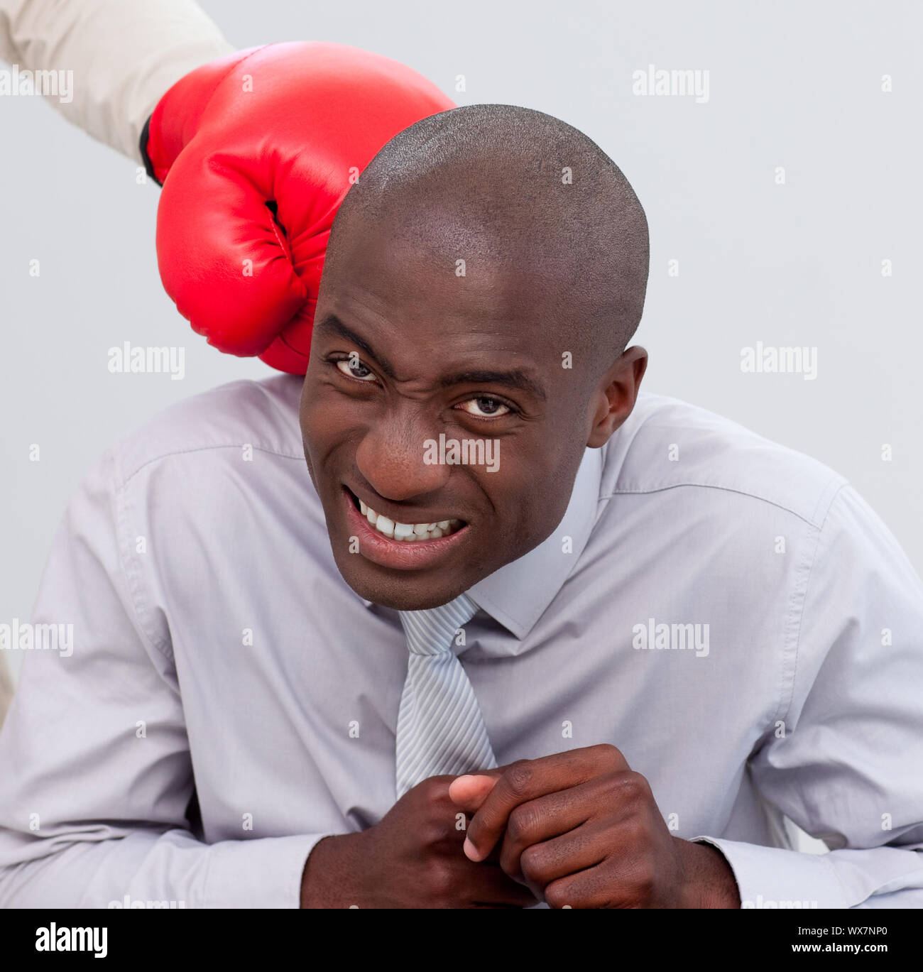 Portrait of an Afro-American businessman being boxed in the office ...