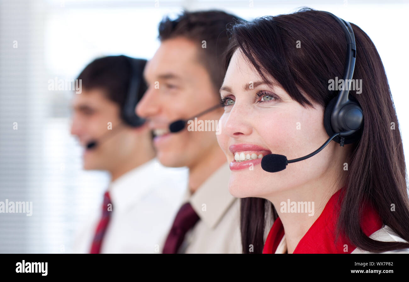 Happy co-workers with headsets on in call center Stock Photo - Alamy