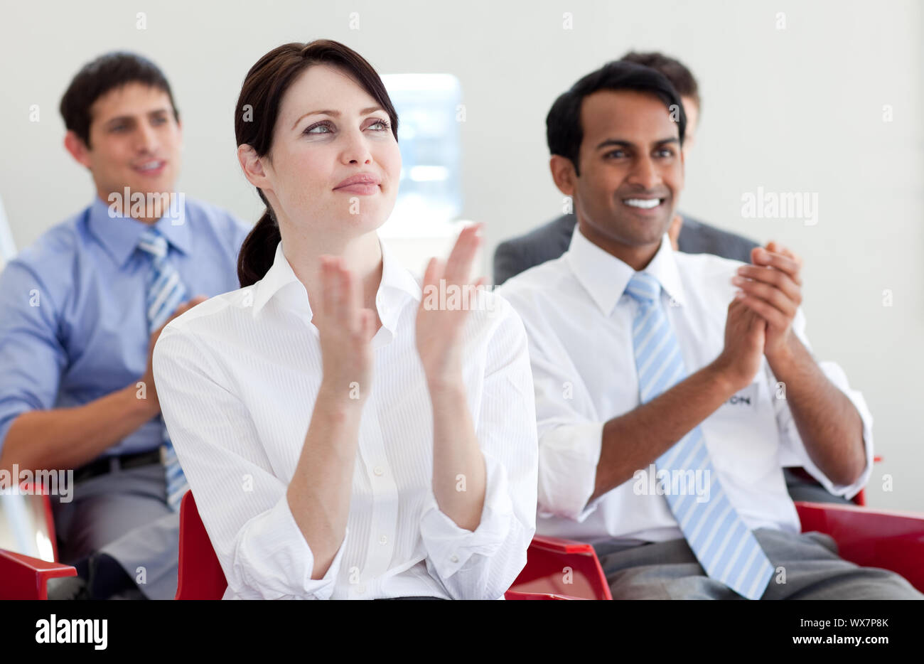 International business people clapping at a conference. Business ...