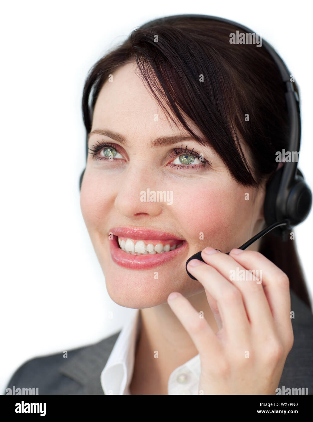 Positive customer service agent using headset against a white ...