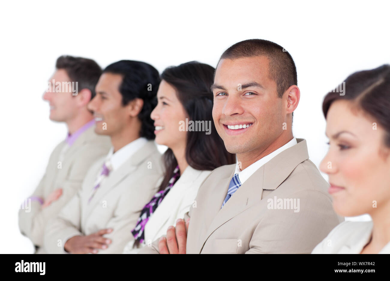 Charming businessman and his team lining up against a white background ...