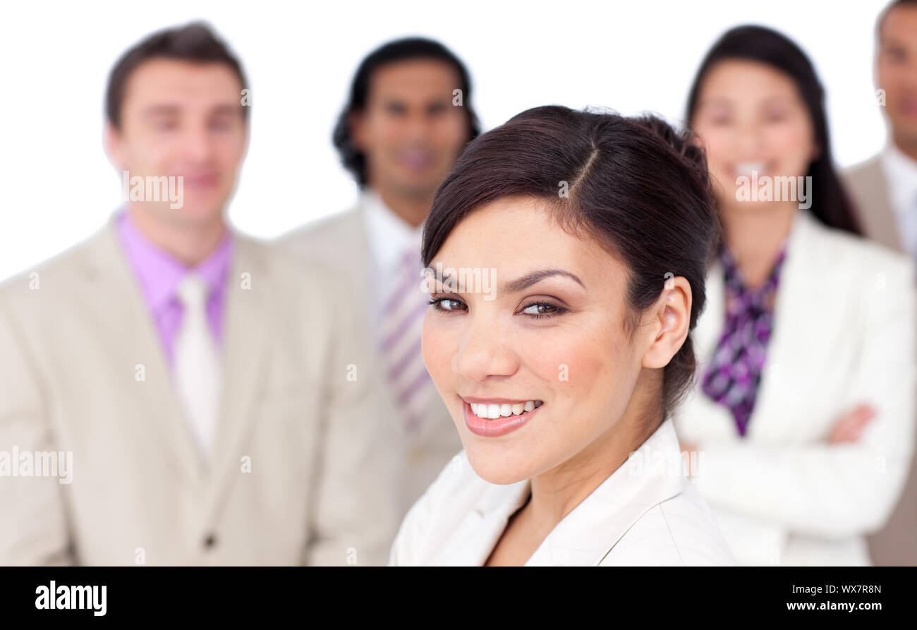 Charming female executive presenting her team against a white ...