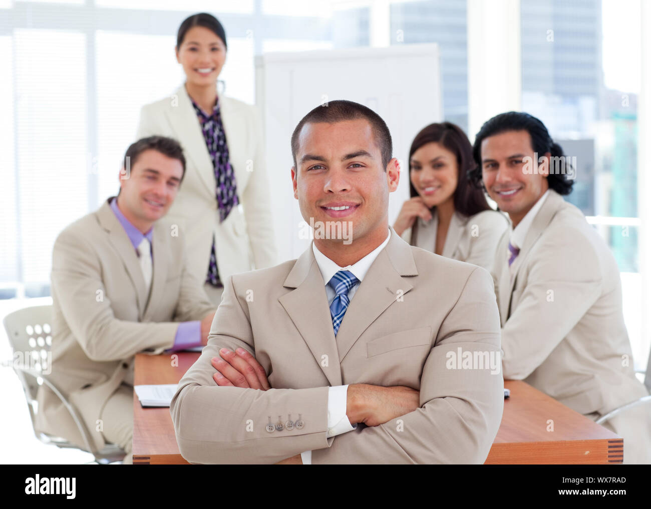 Assertive businessman in a meeting with his team Stock Photo - Alamy