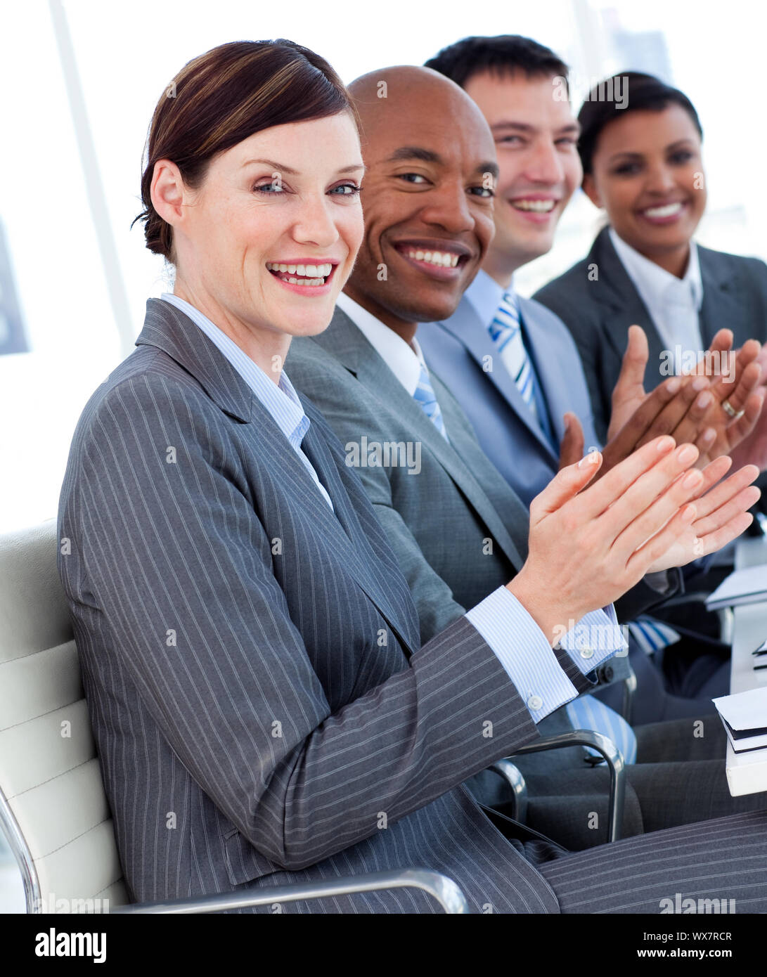 International business team clapping a good presentation in a meeting ...