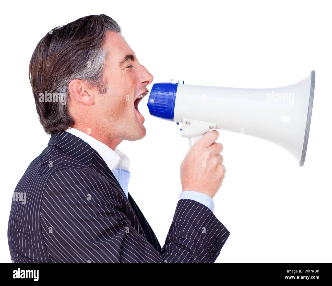 Businessman shouting instructions through a megaphone isolated on a ...