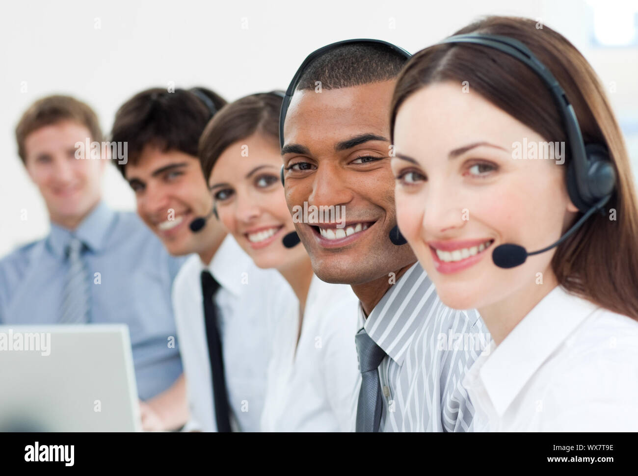 International customer service agents with headset on in a call center Stock Photo - Alamy