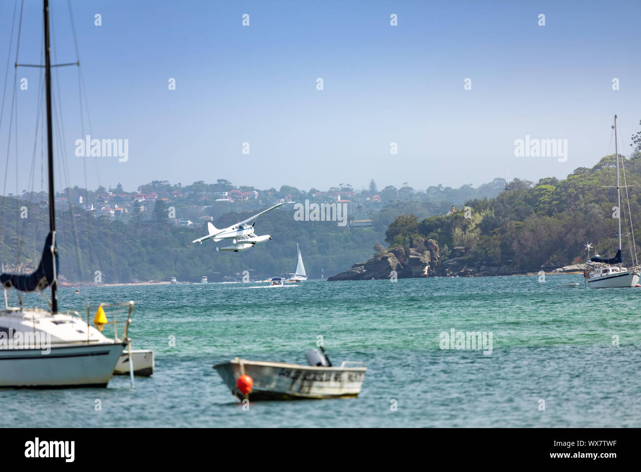 plane flying over the ocean in Sydney Australia Stock Photo - Alamy