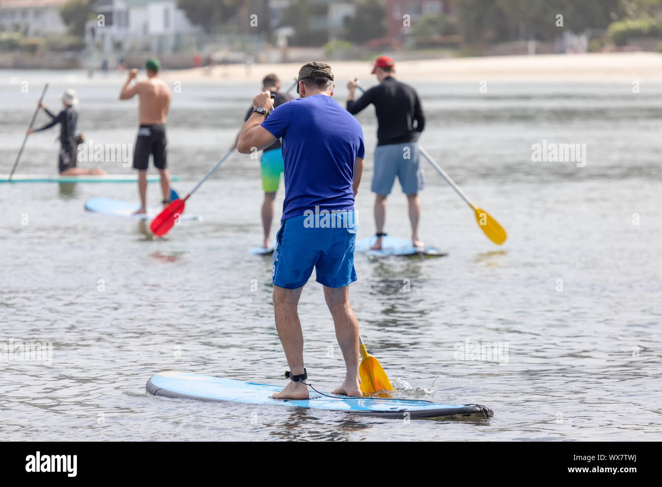 men paddling in the ocean Stock Photo - Alamy