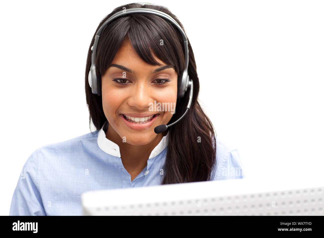 Positive Ethnic Customer Service Representative Using Headset In A Call