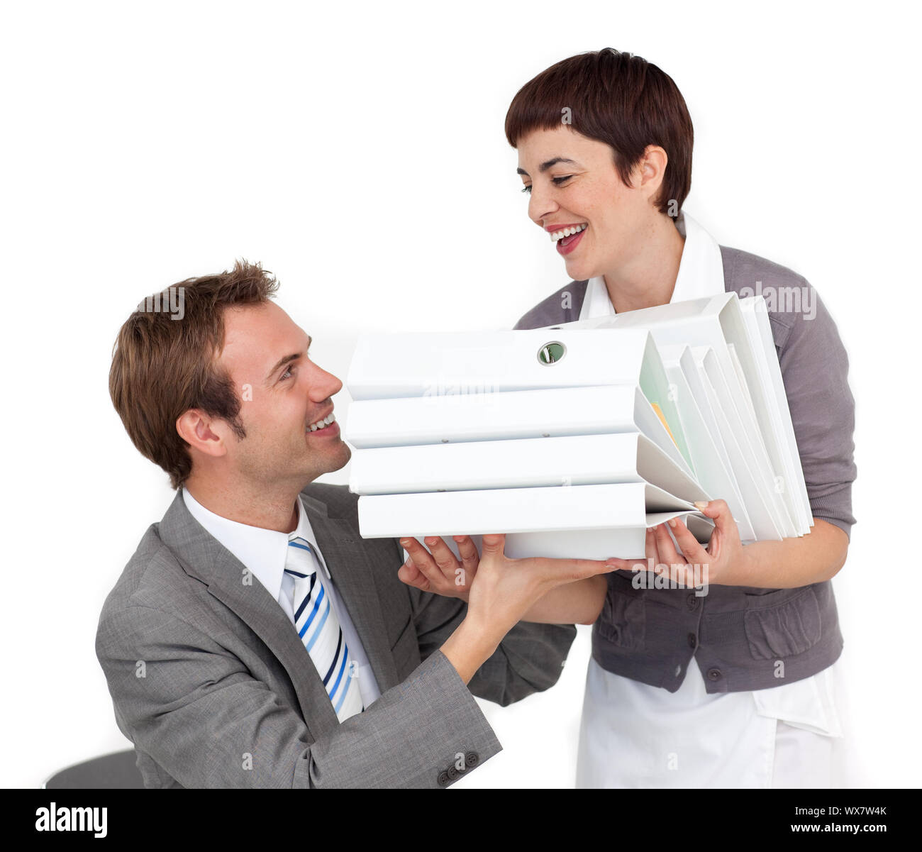 Charming Businesswoman bringing a pile of folders to her colleague in ...