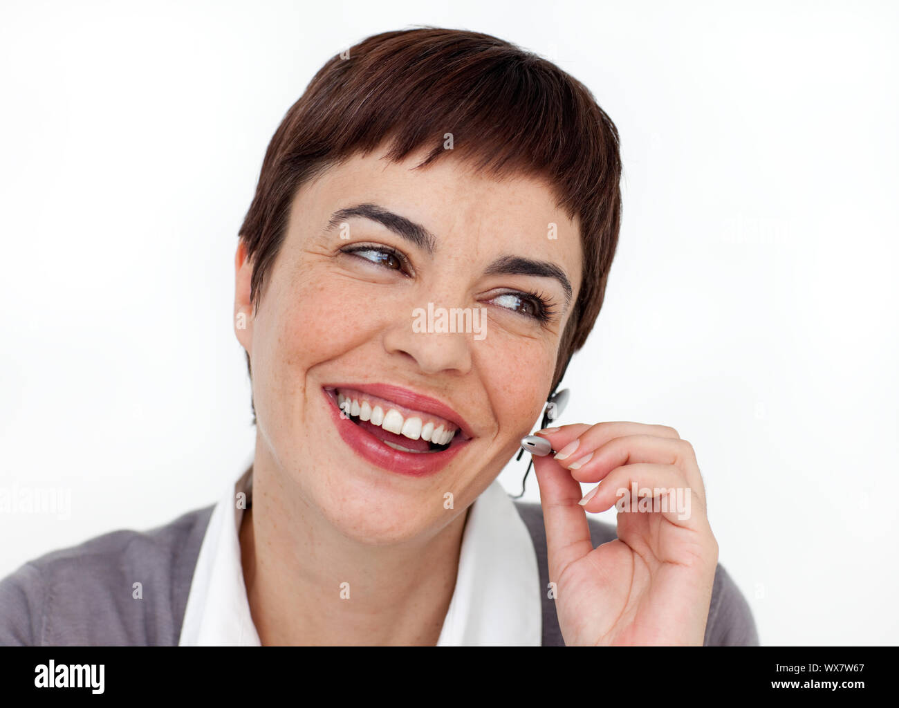 Assertive customer service representative using headset against a white ...