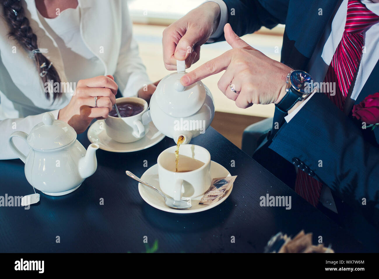 Two People Drinking Tea