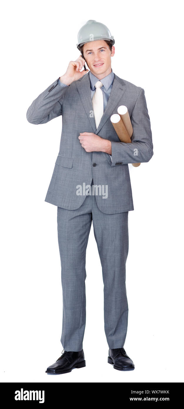 Assertive male architect talking on phone standing in front of the ...