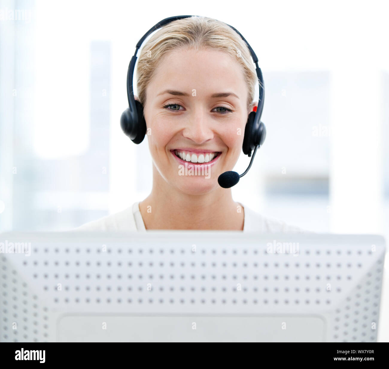 Assertive customer service representative working in a call center ...