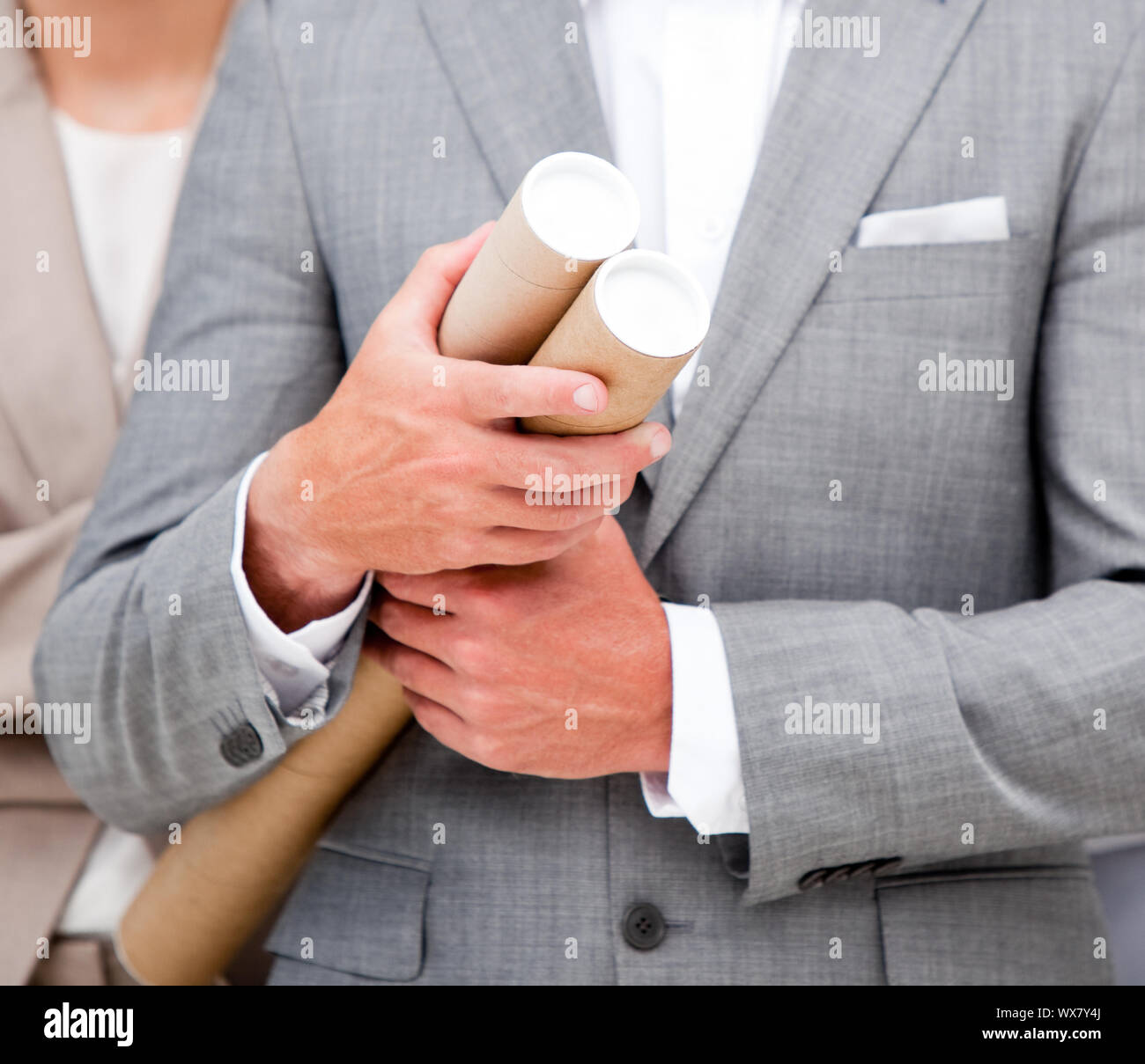Close-up of a male architect holding blueprints Stock Photo - Alamy