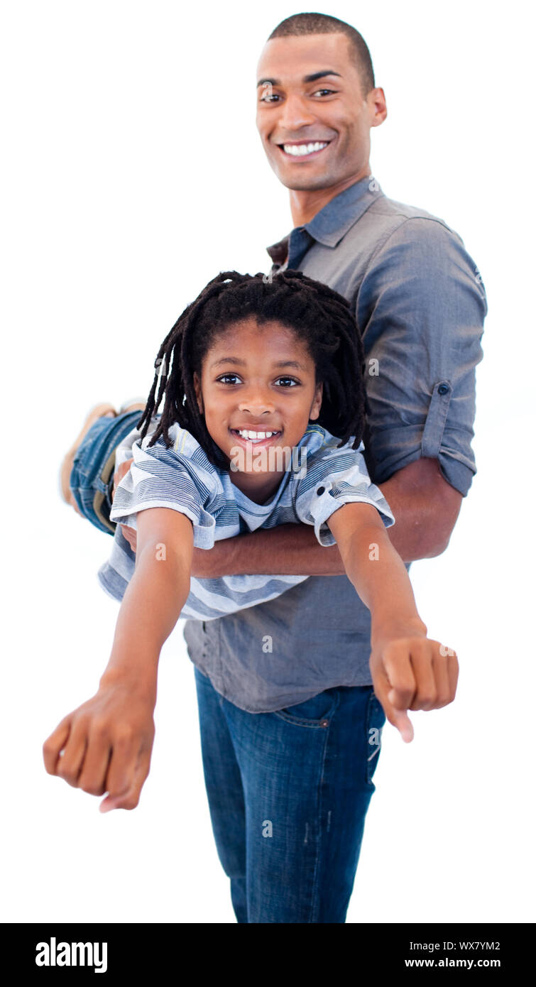 Afro-American father playing woth his son against white background ...
