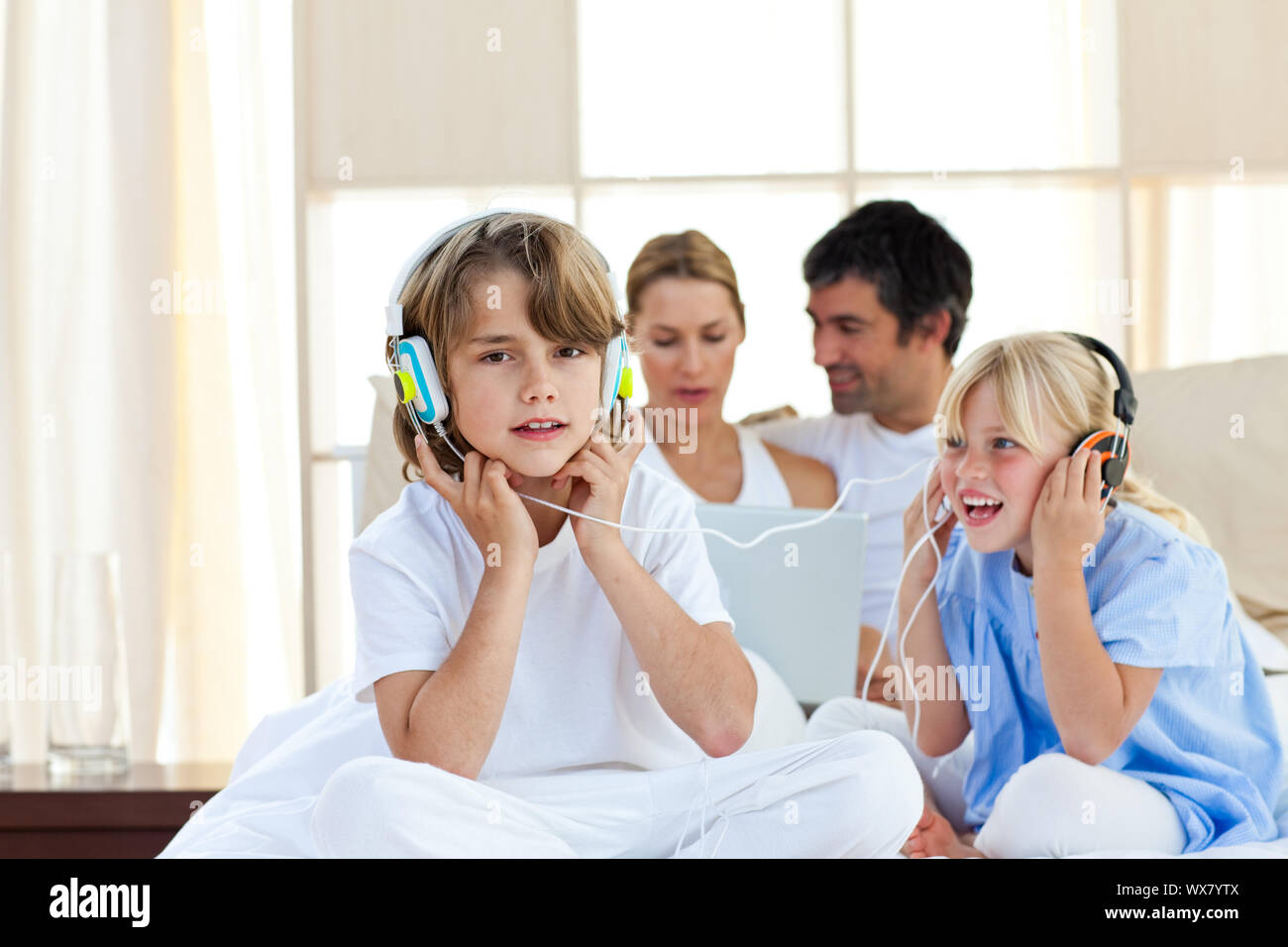 Animated children having fun and listening music at home Stock Photo ...