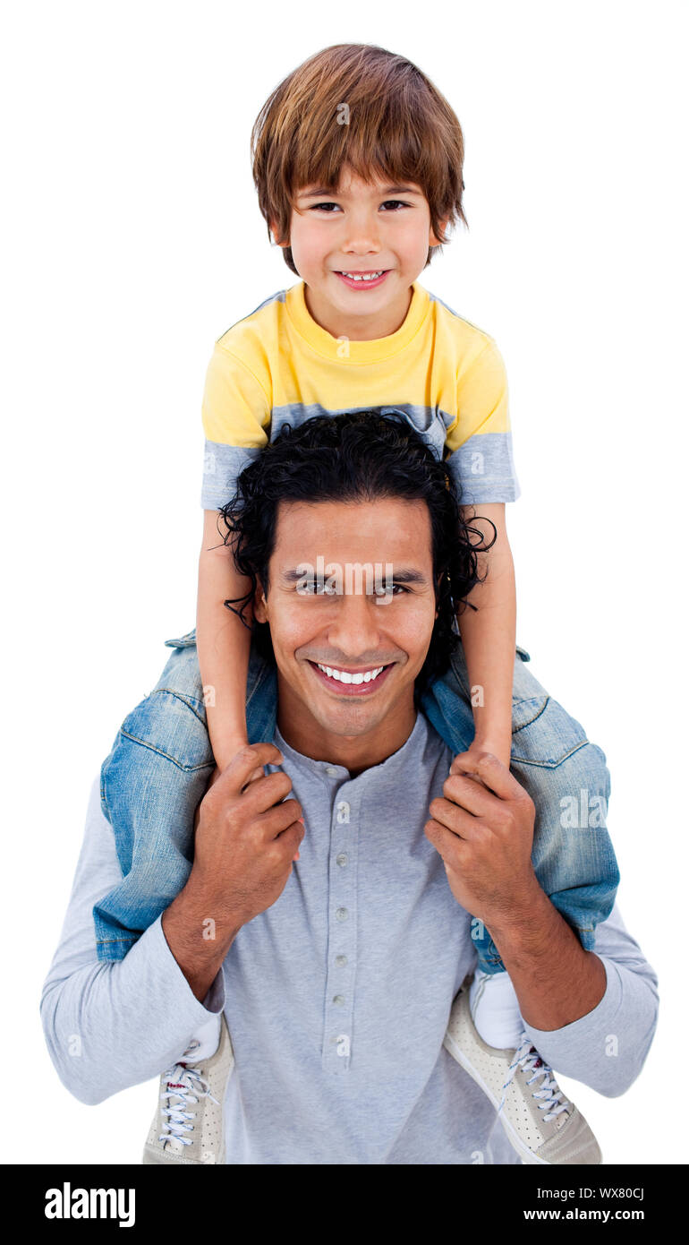 Happy little boy on his father's shoulders against a white background ...