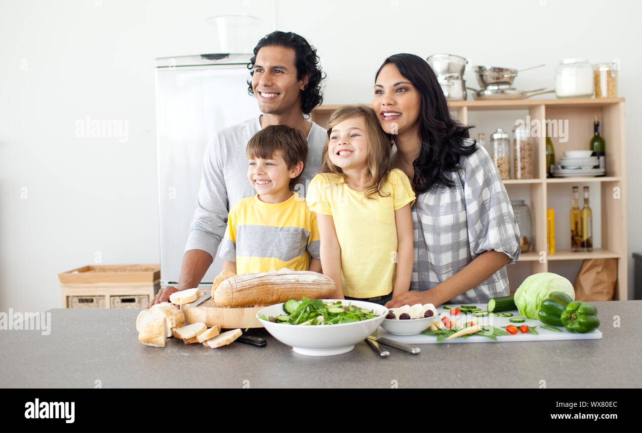 Merry family preparing lunch together in the kitchen Stock Photo - Alamy