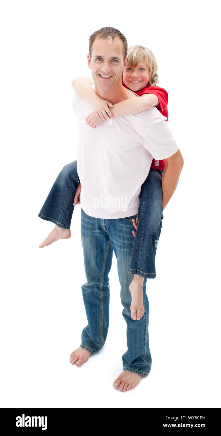 Affectionate father giving his son piggyback ride against a white background Stock Photo - Alamy