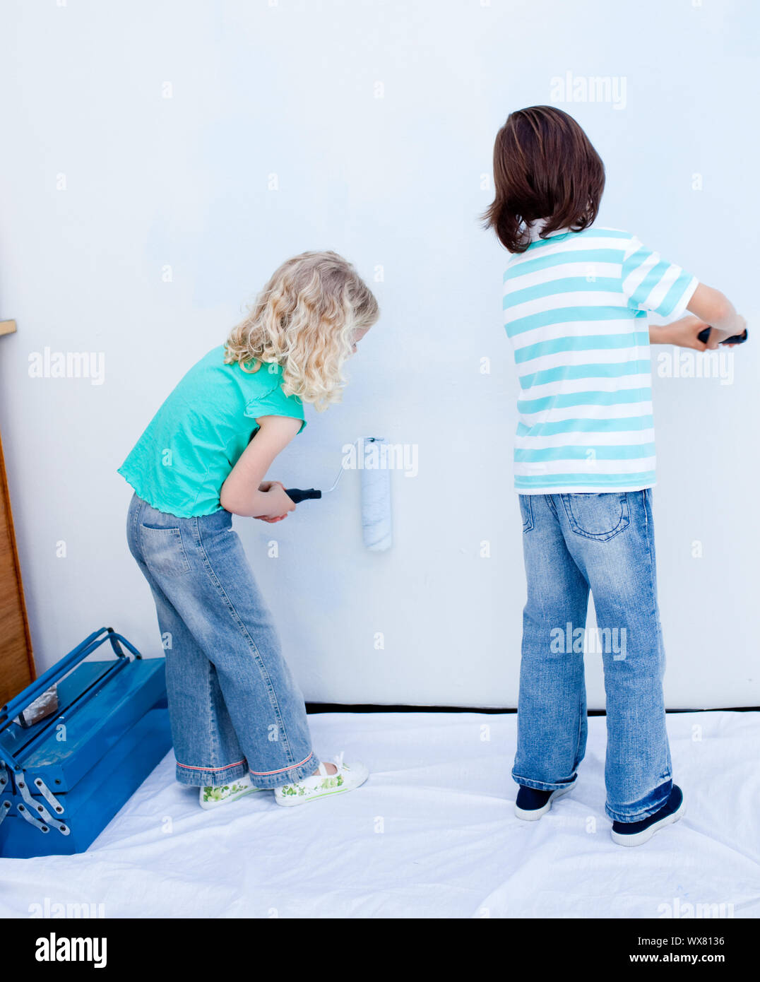 Two loving siblings decorating their new house Stock Photo - Alamy