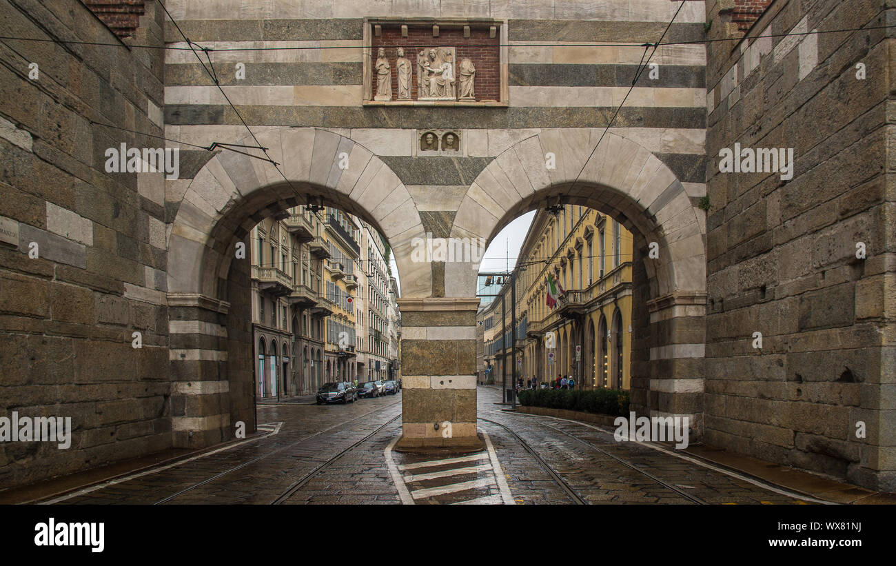 striped wall with gate to city Stock Photo - Alamy