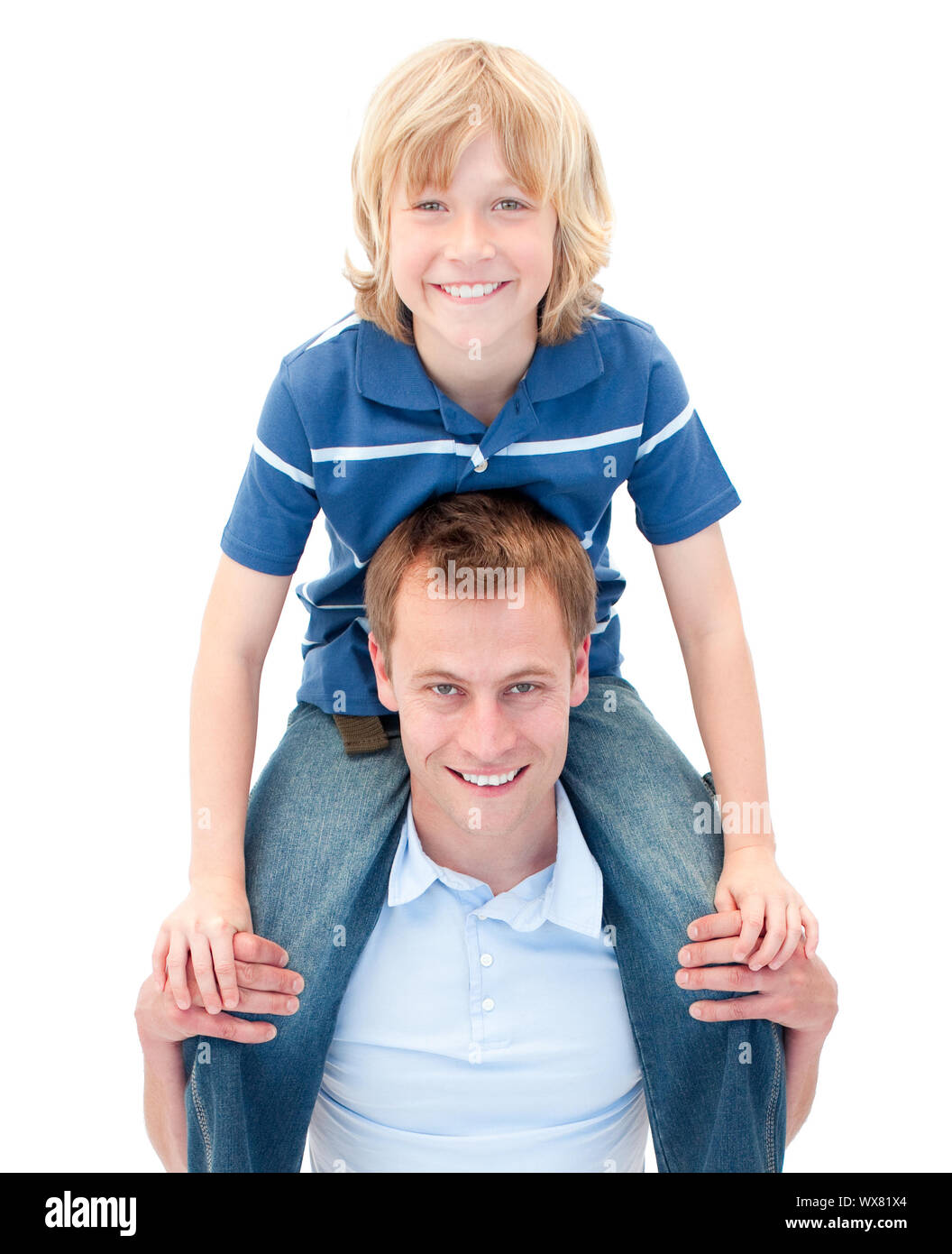 Close-up of father giving his son piggyback ride against a white ...