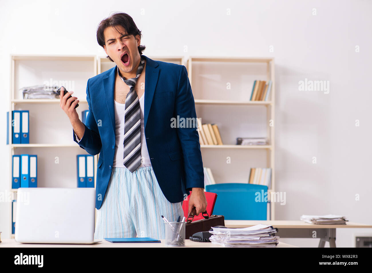 Employee coming to work straight from bed Stock Photo - Alamy