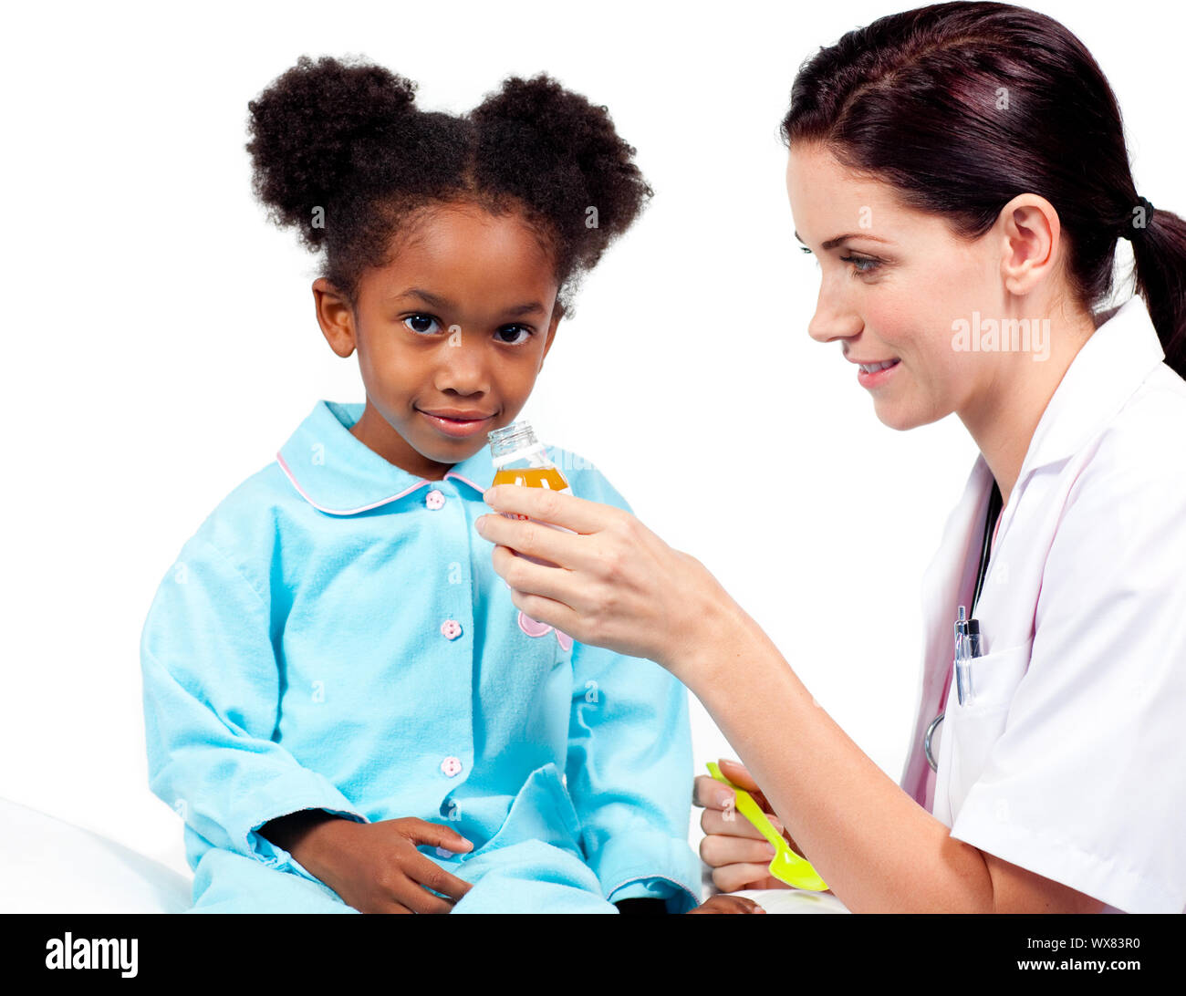 Caring doctor giving medicine to her patient isolated on a white ...