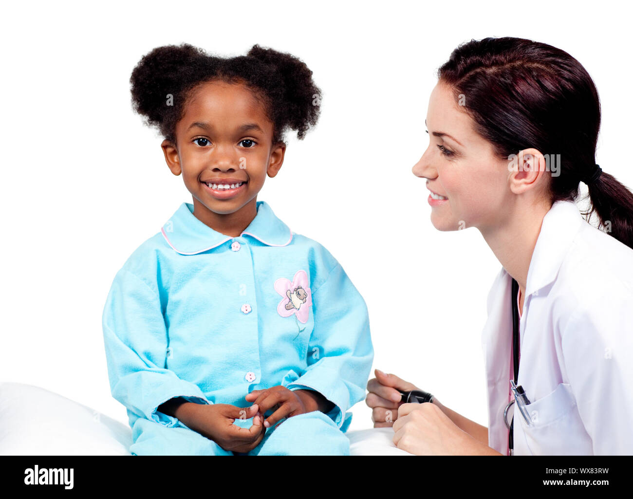 Cute little girl attending medical check-up isolated on a white ...
