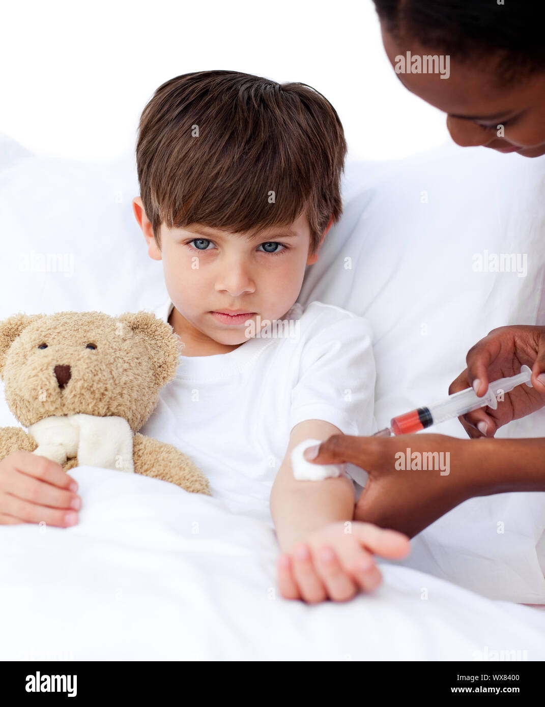 Adorable little boy receiving an injection in a hospital Stock Photo ...