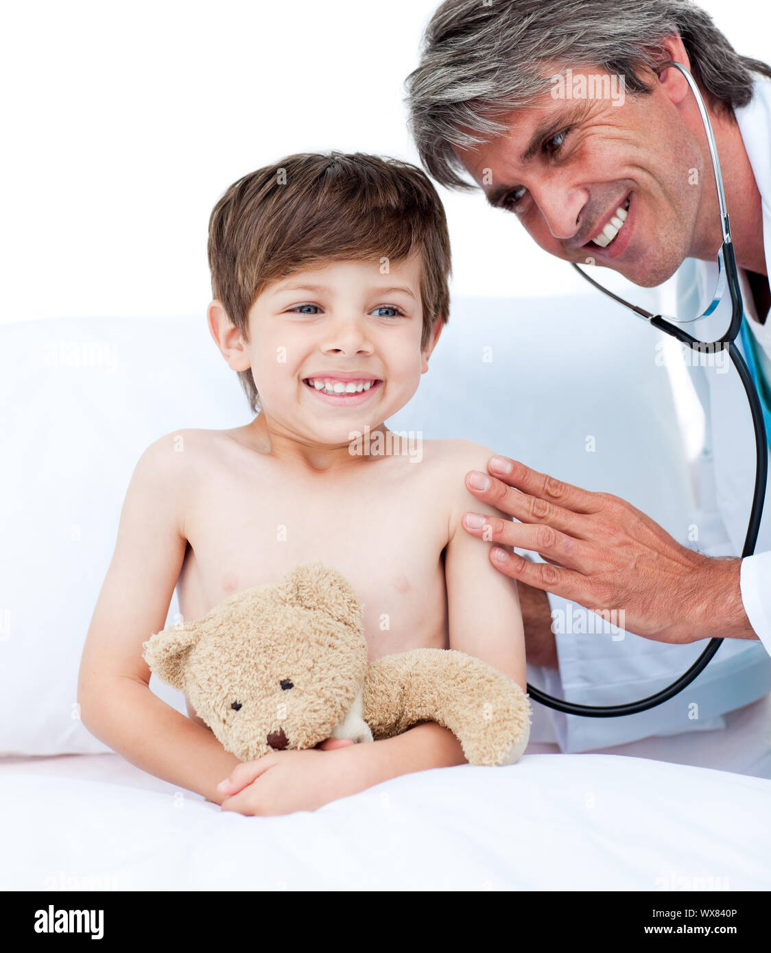 Adorable little boy attending a medical check-up in a hospital Stock ...
