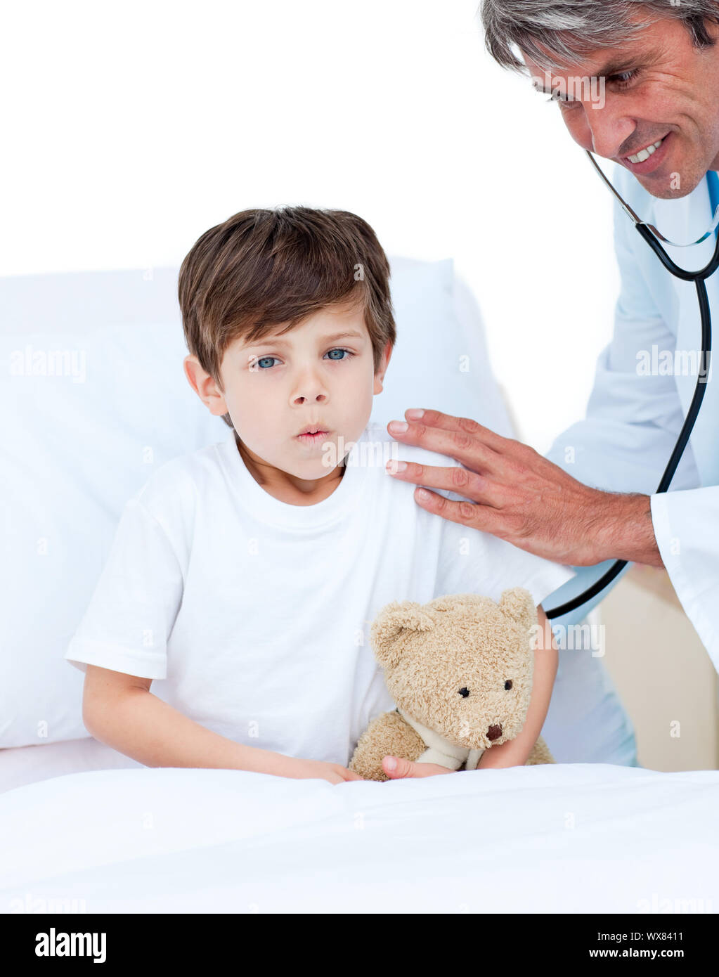 Cute little boy attending a medical check-up in a hospital Stock Photo ...