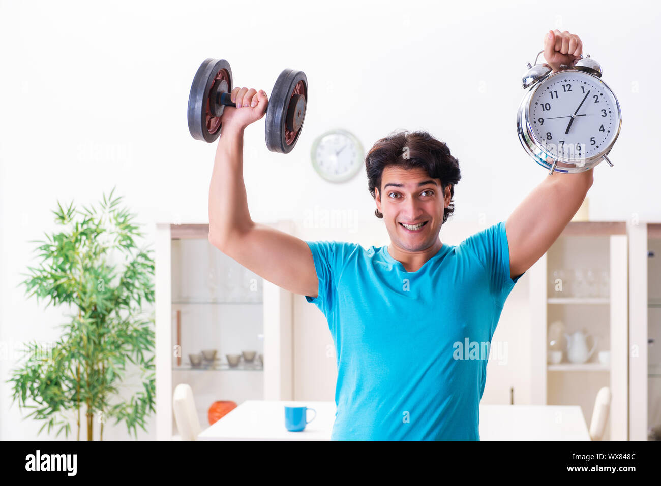 Young handsome man doing morning exercises Stock Photo - Alamy