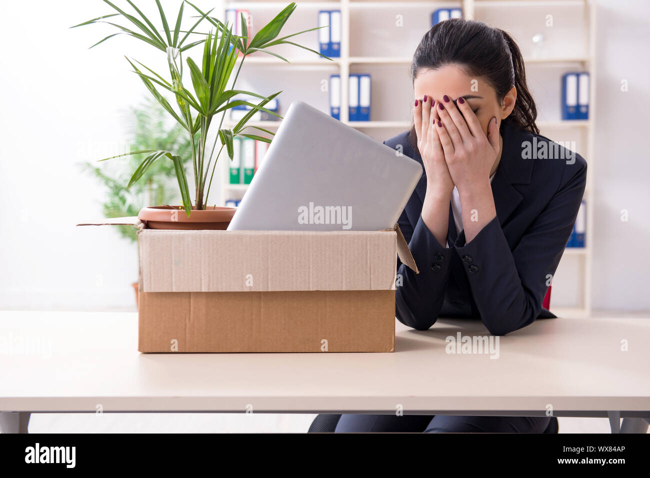 Young female employee being fired from her work Stock Photo - Alamy
