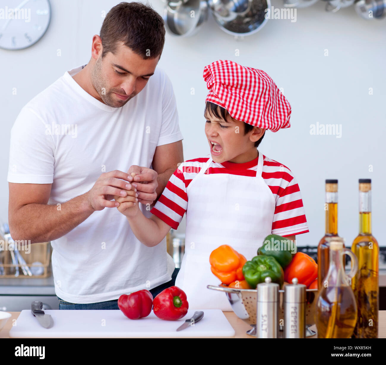 Boy cut finger in kitchen hi-res stock photography and images - Alamy