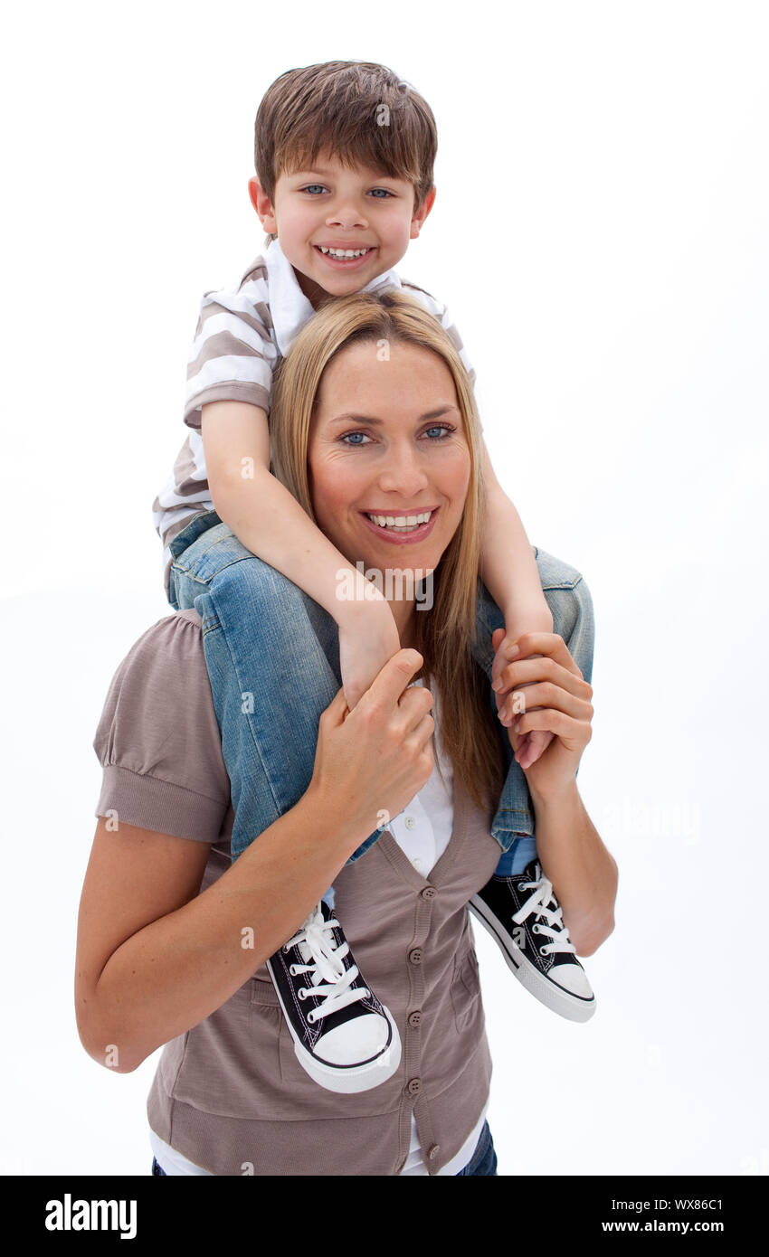 Mother giving son piggy back ride against white background Stock Photo - Alamy