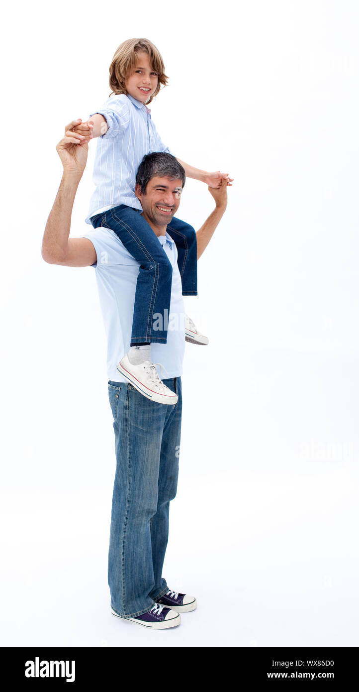 Dad giving little boy piggy back ride against white background Stock ...