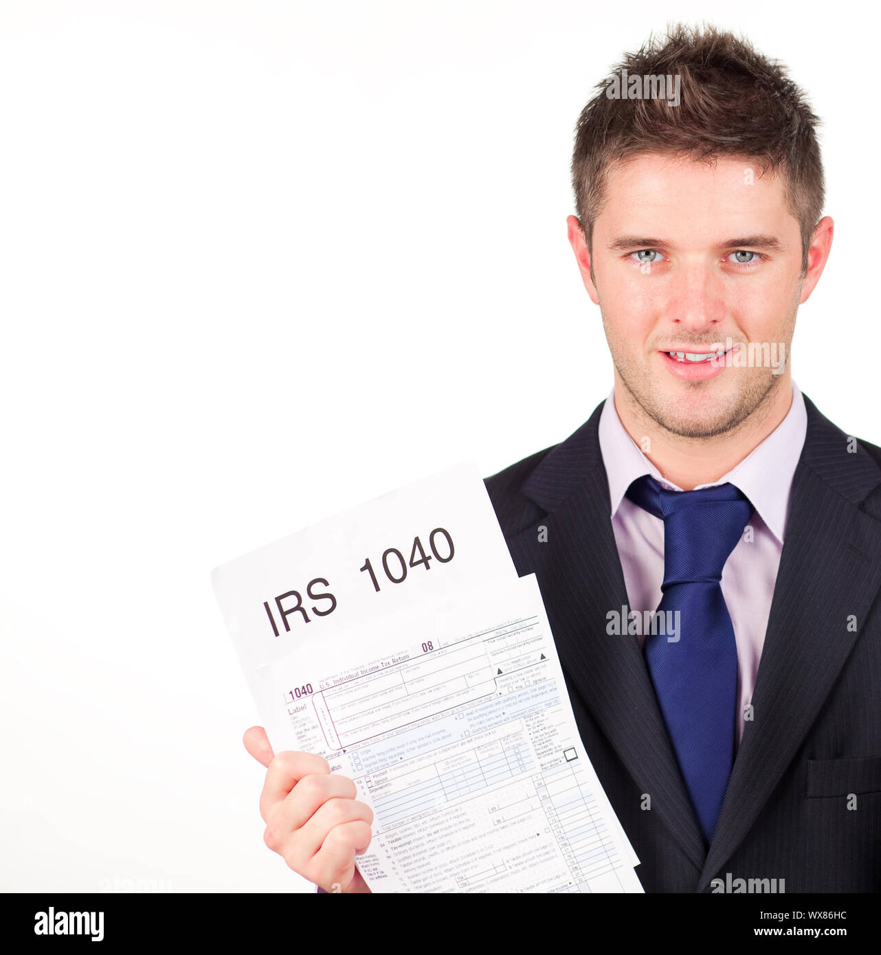 Man holding out his irs returns form ot the camera Stock Photo - Alamy